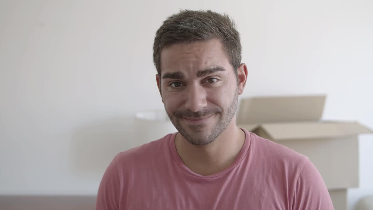 Free stock video - Portrait of happy young man standing in the living ...