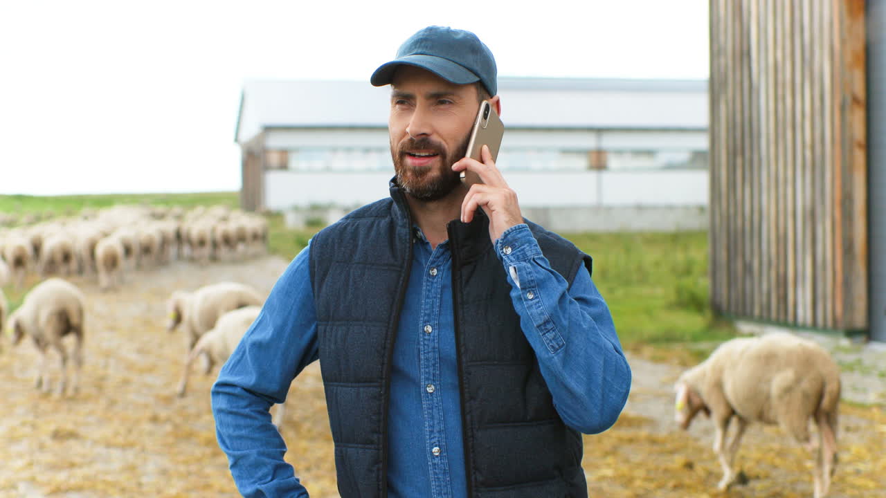 Free stock video - Caucasian farmer man talking on smartphone outside