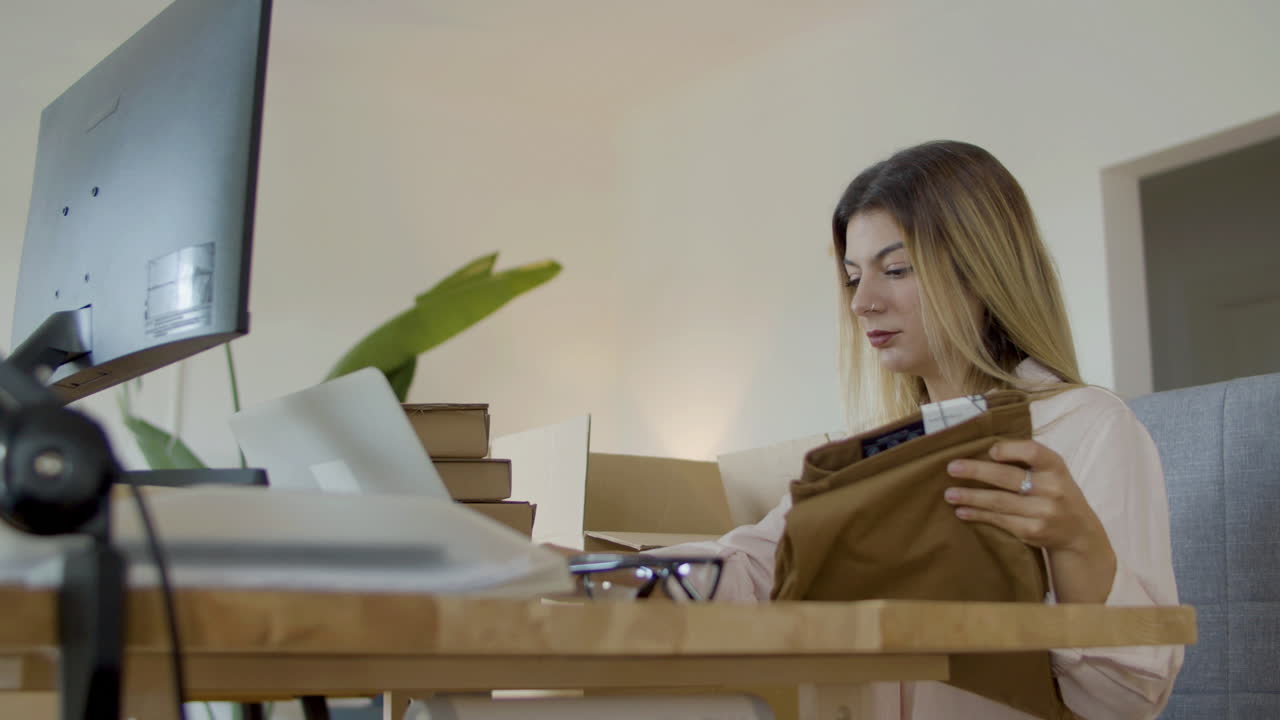 Free stock video - Young caucasian woman checking clothing label and ...