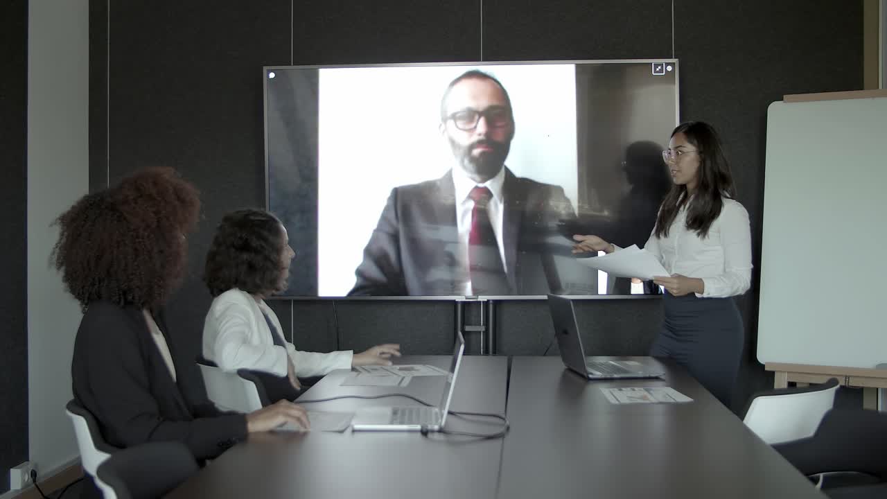 Free stock video - Young office employee reading report during video ...