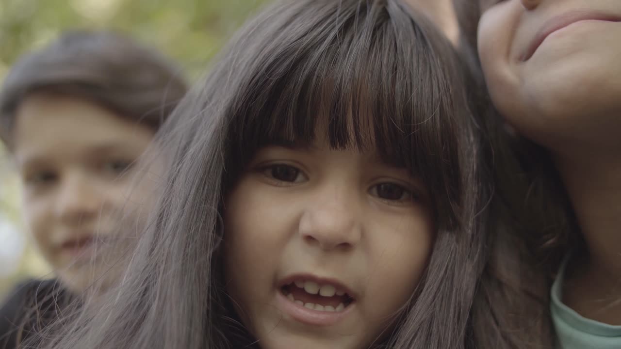 Free stock video - Closeup portrait of kids looking at camera and smiling