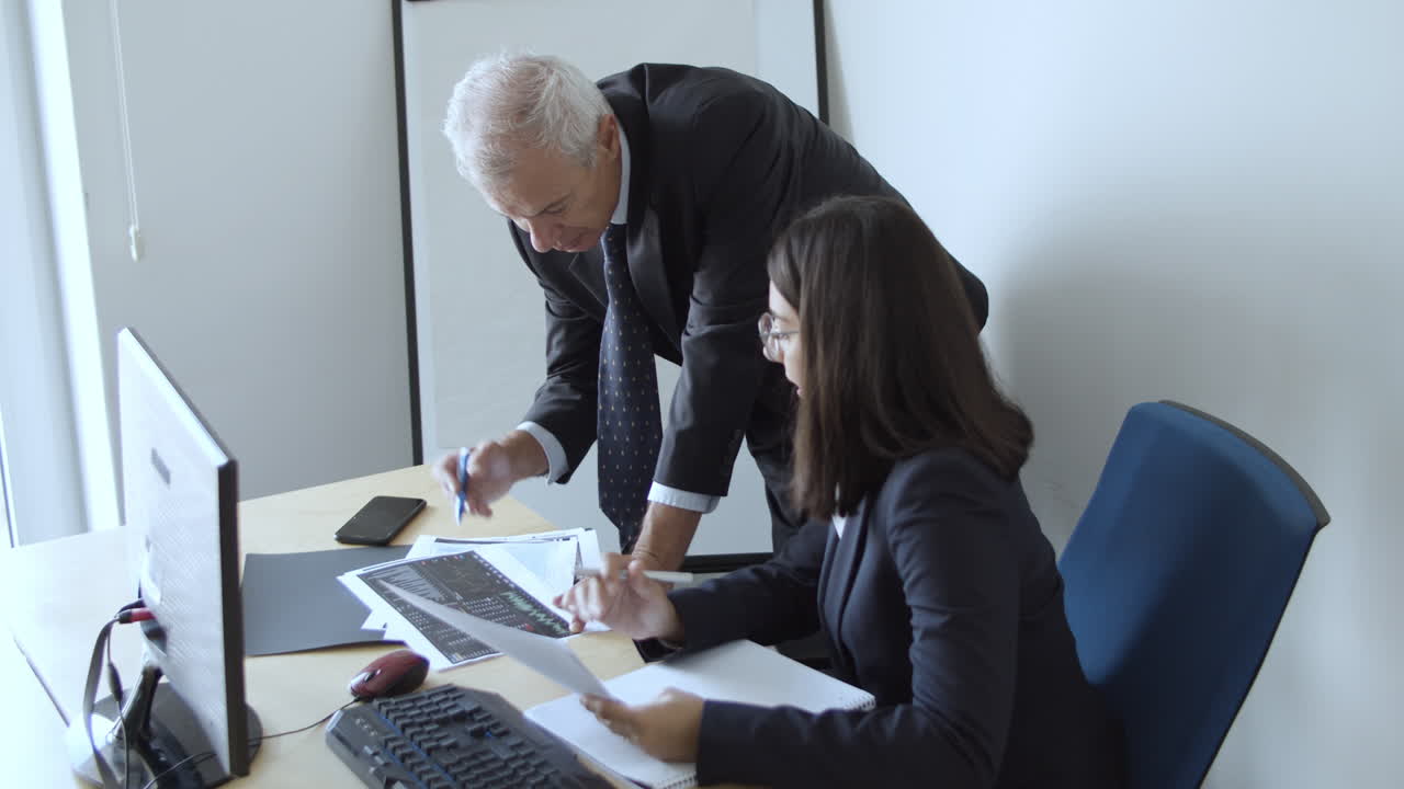 Free stock video - Serious mature financial experts explaining chart ...