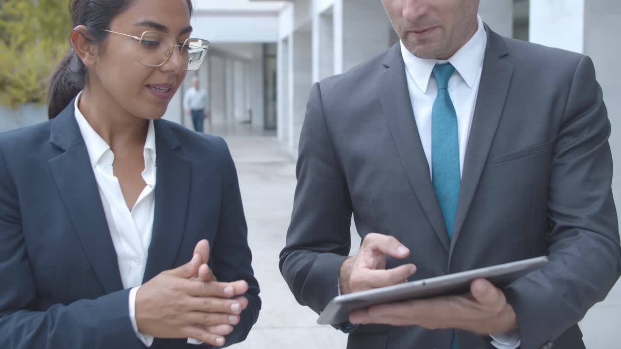 Free stock video - Front view of two business colleagues discussing ...