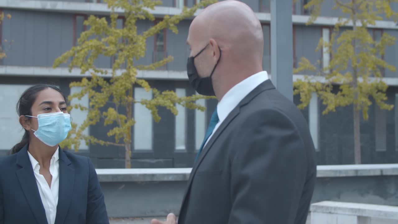 Free stock video - Happy business colleagues in face masks meeting at ...