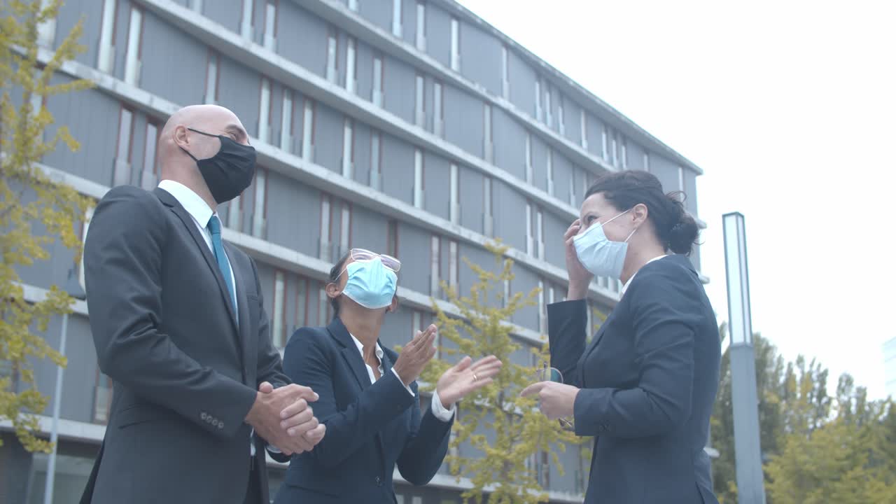 Free stock video - Business colleagues in face masks meeting outside ...