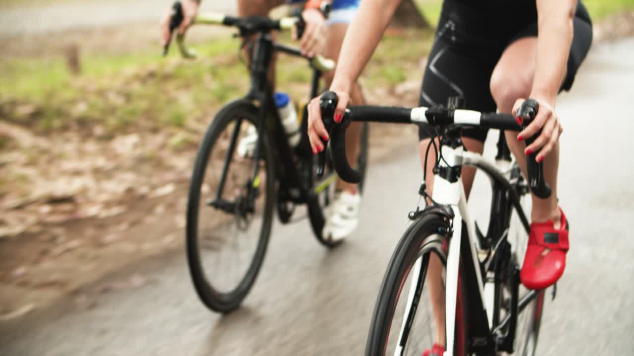 Free stock video - Cropped shot of athletes riding bicycles