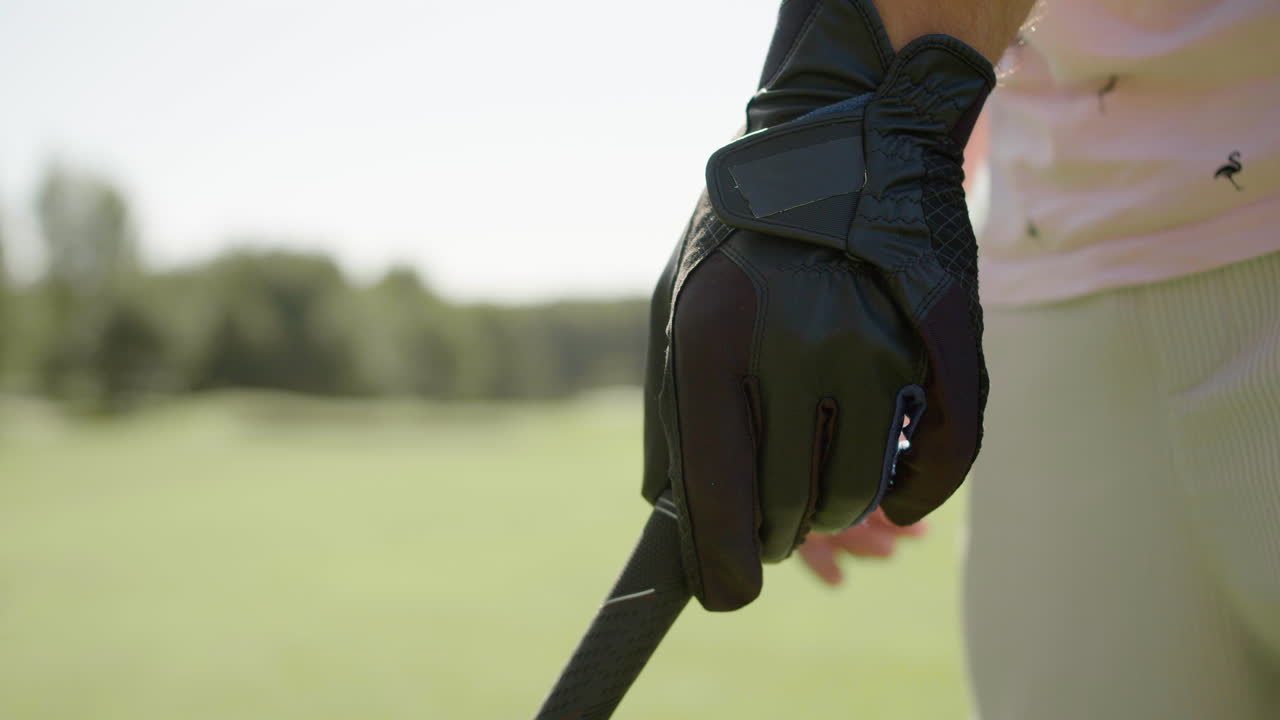 Free stock video - Hand in glove grabbing golf club, ready to hit the ...