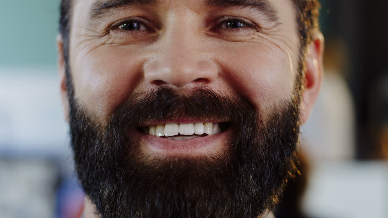 Free stock video - Close-up view of caucasian bearded man smiling at ...