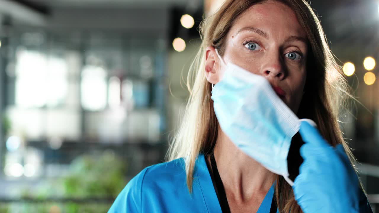 Free stock video - Close up of female physician taking off medical mask ...