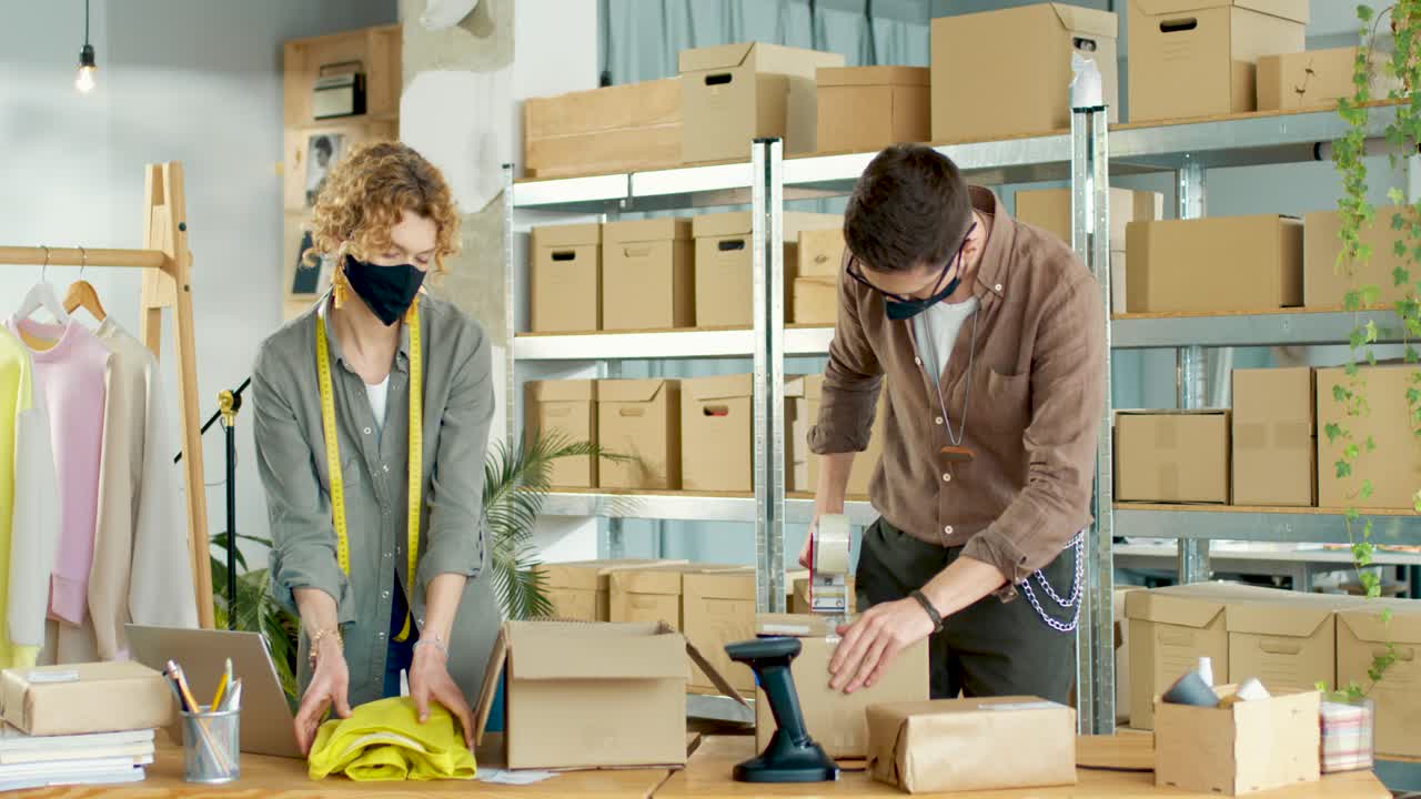 Free stock video - Caucasian young woman and man working in clothing ...