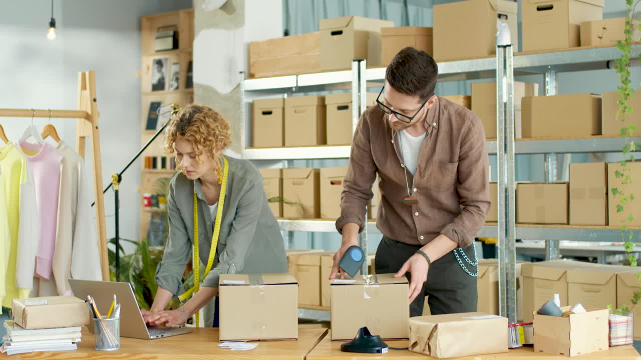Free stock video - Caucasian man working in clothing store packing ...