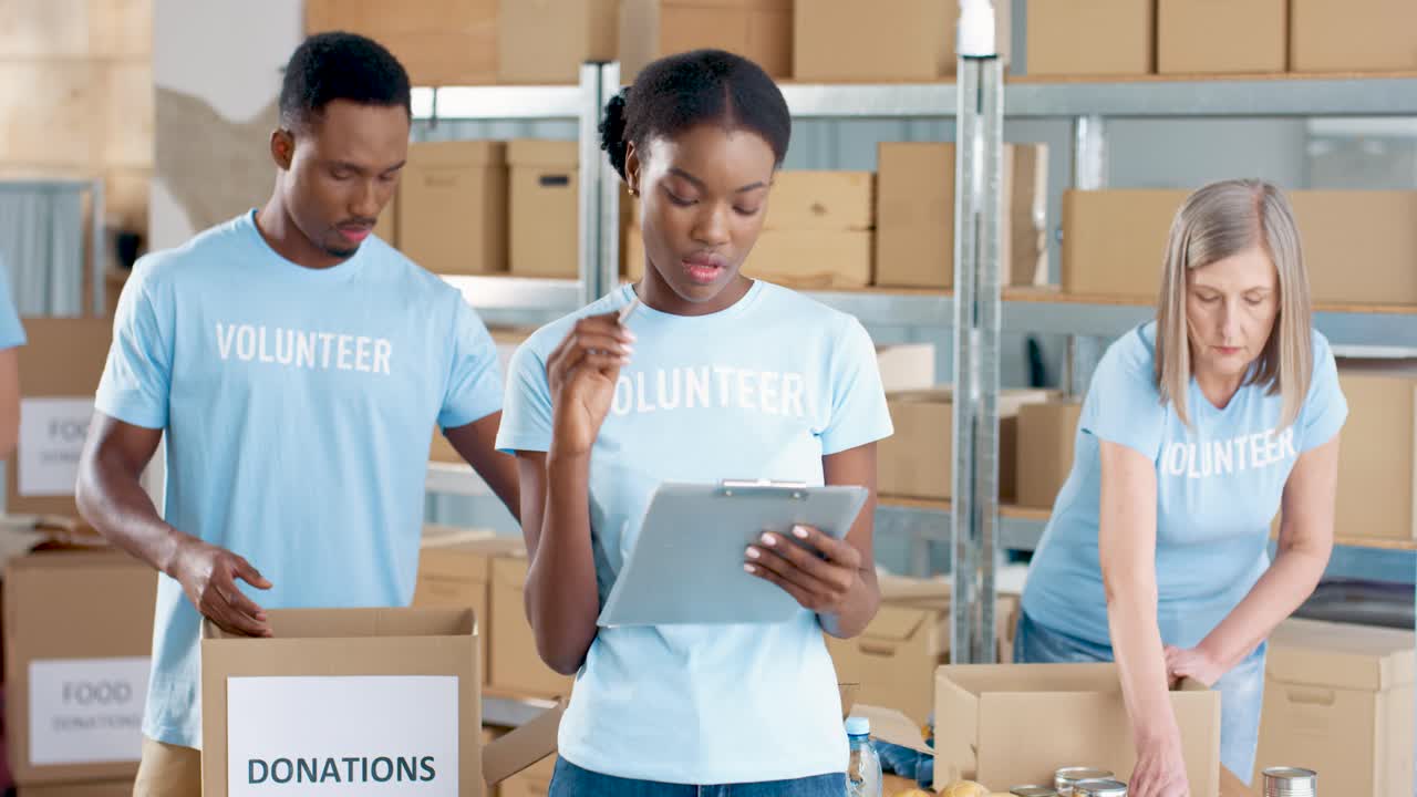 Free stock video - Young african american female volunteer writing and ...