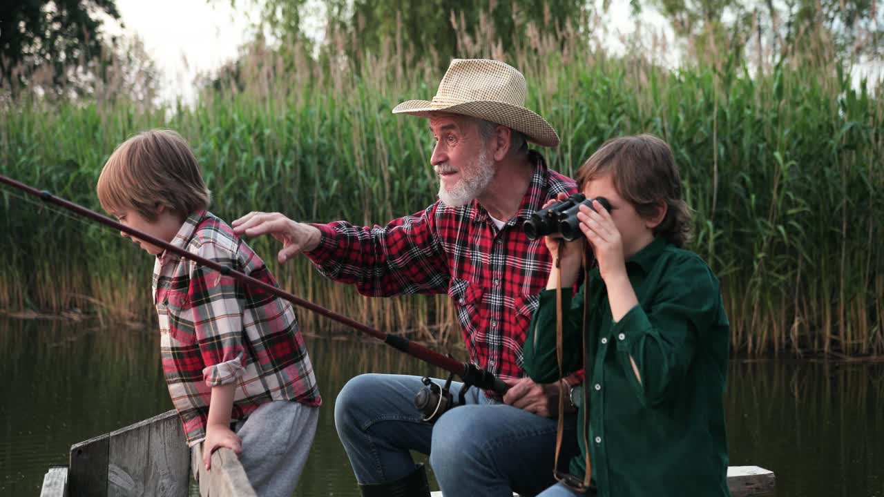 Free stock video - Cute teen boy using binoculars and showing something ...
