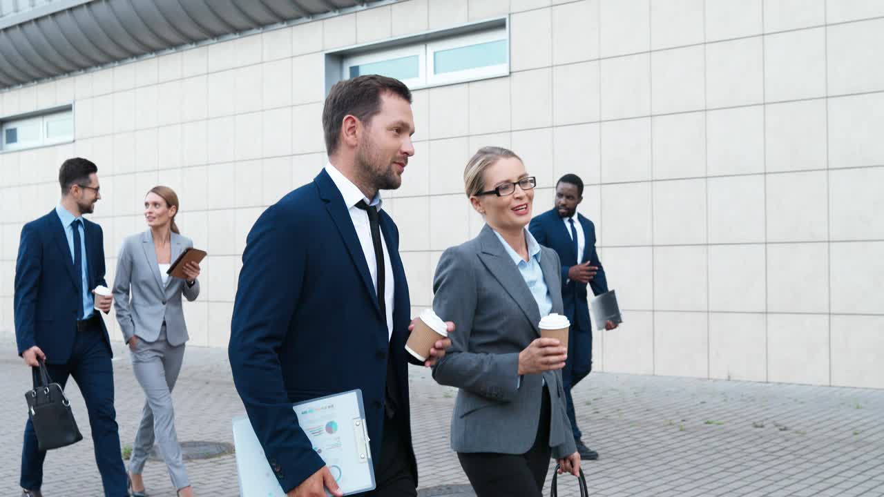 Free stock video - Caucasian couple of happy businessman and businesswoman walking down the ...