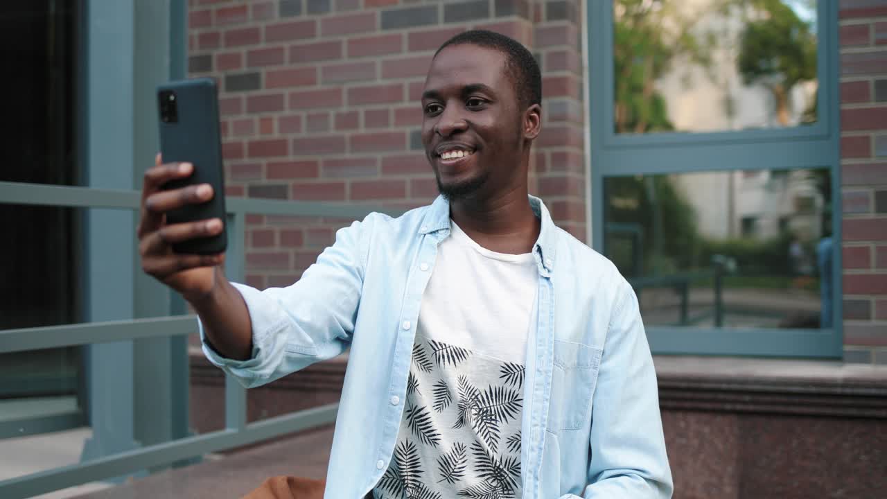 Free stock video - African american student man having a video call on ...