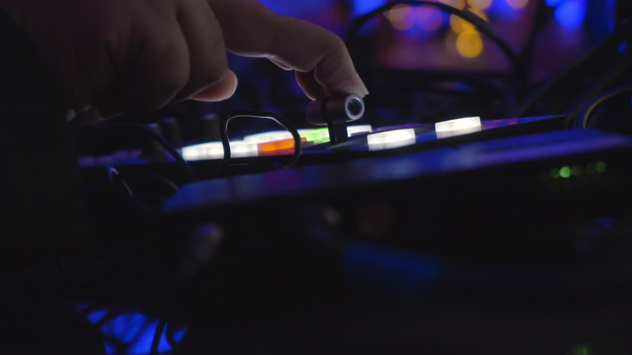 Premium stock video - Close up of a video switcher-mixer being used ...