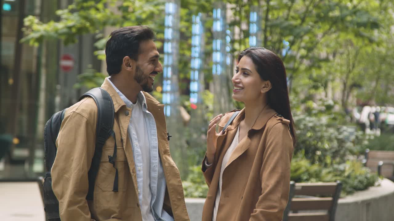 Free stock video - Muslim couple on date talking together on city street 1