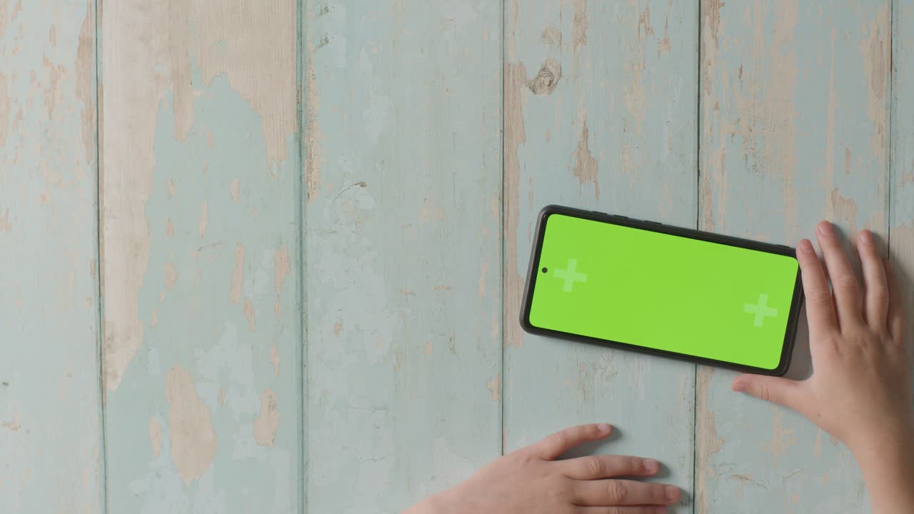 Free stock video - Overhead shot of child holding green screen digital ...