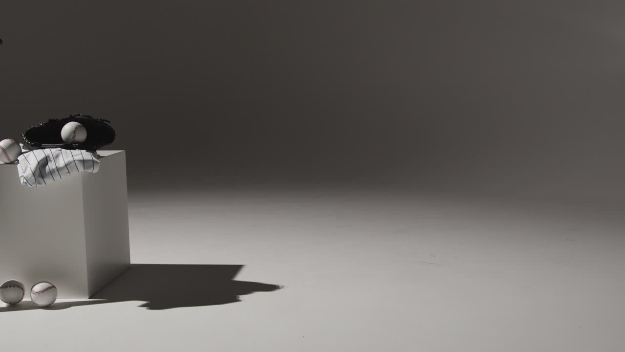 Free stock video - Slow pan across studio baseball still life with bat ...