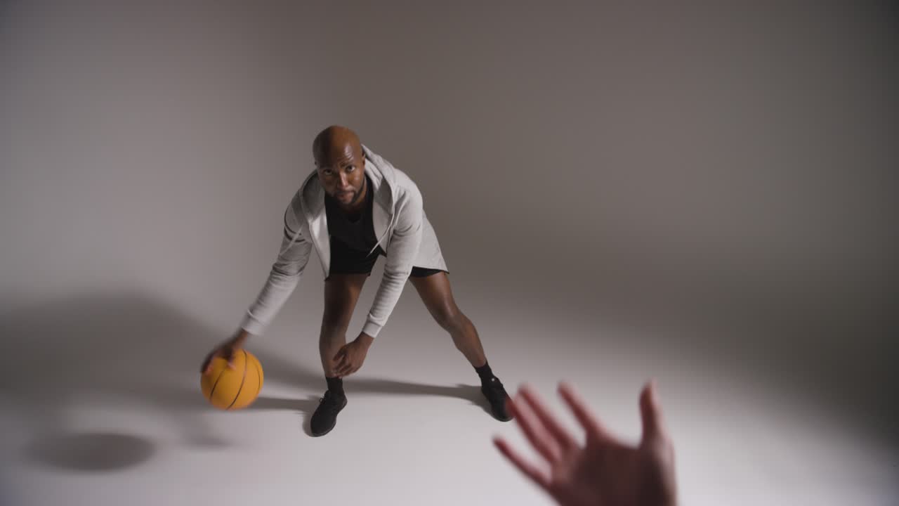 Free stock video - Studio shot of male basketball player dribbling and ...