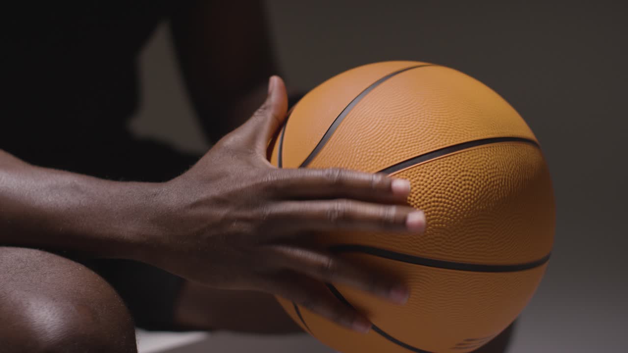 Free stock video - Close up studio shot of seated male basketball ...