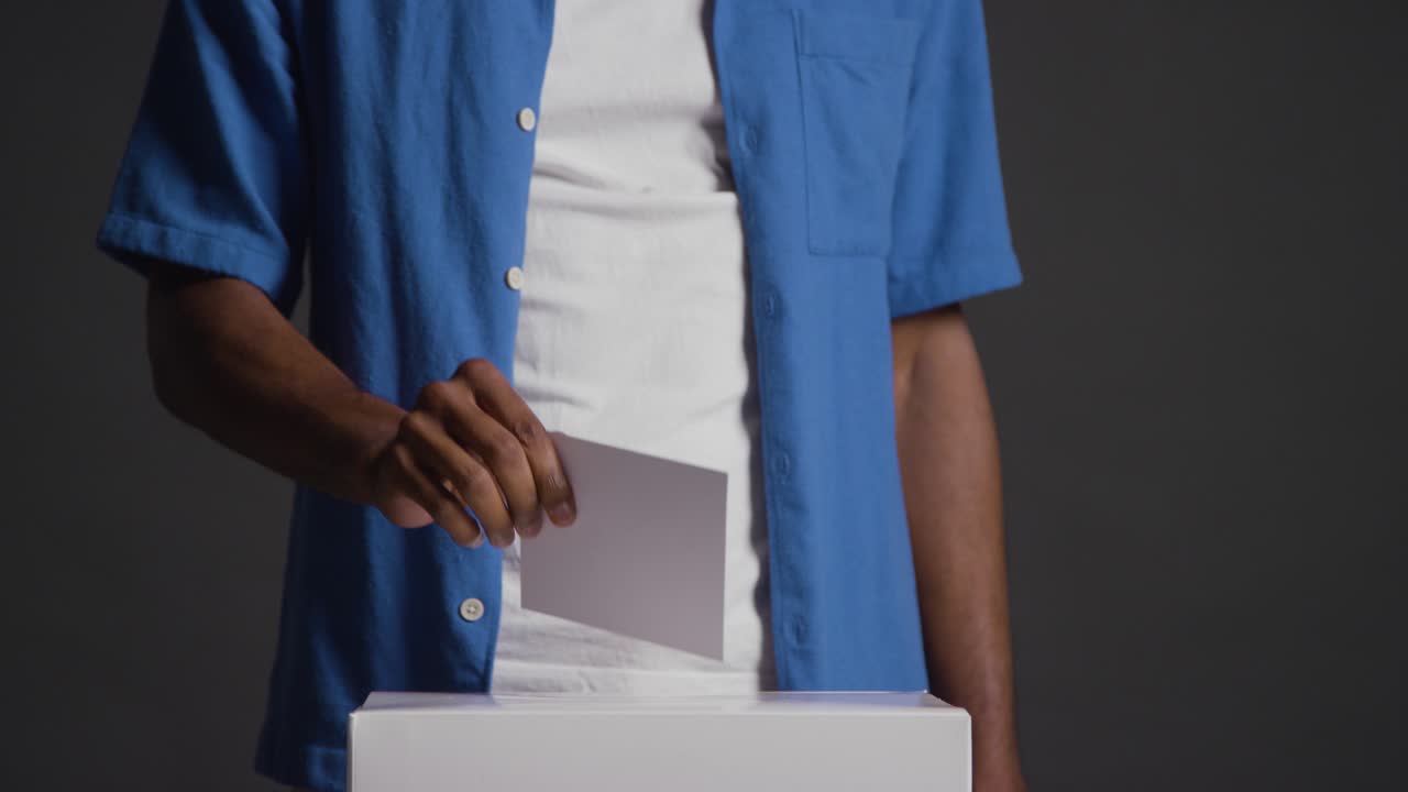 Free stock video - Close up of man casting vote into election ballot ...