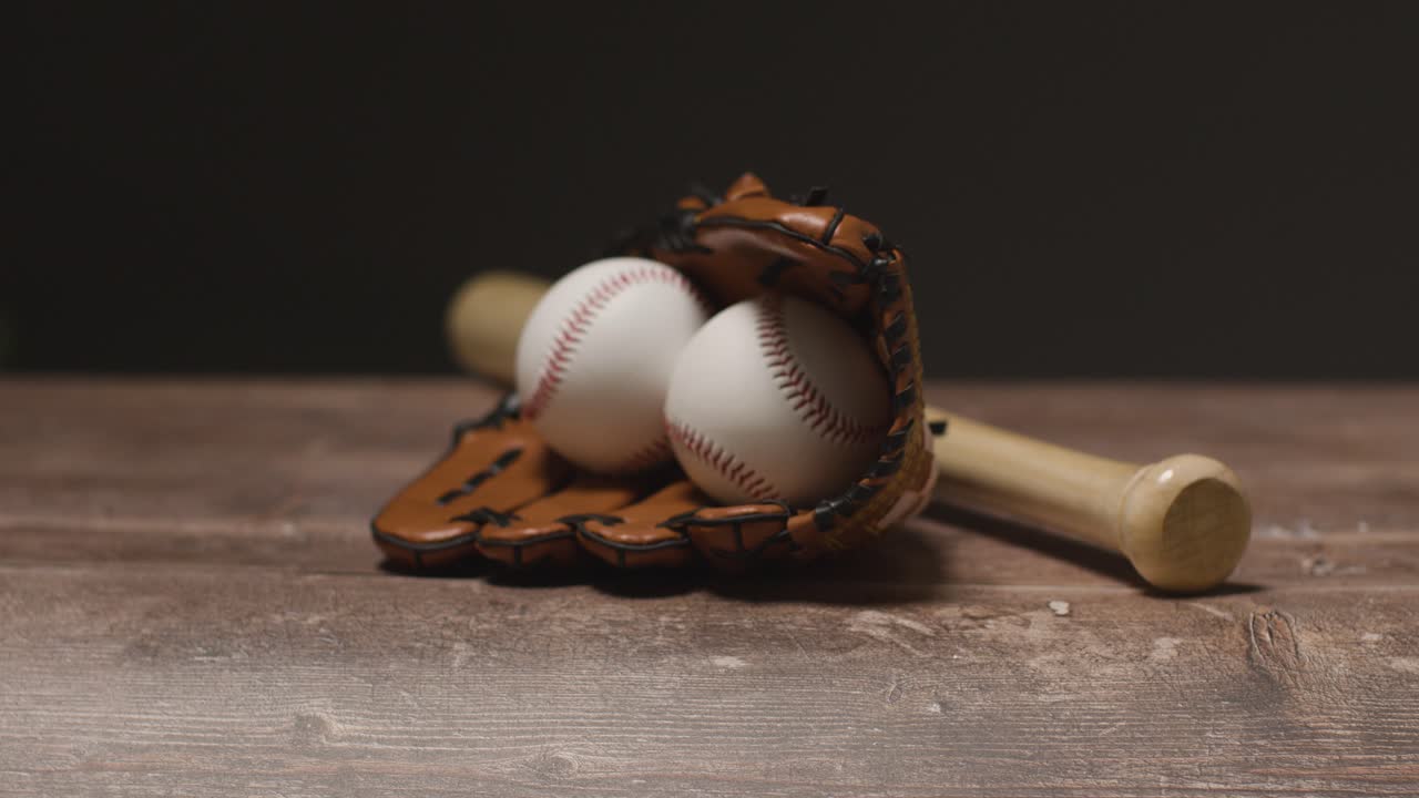 Free stock video - Close up studio baseball still life with wooden bat ...