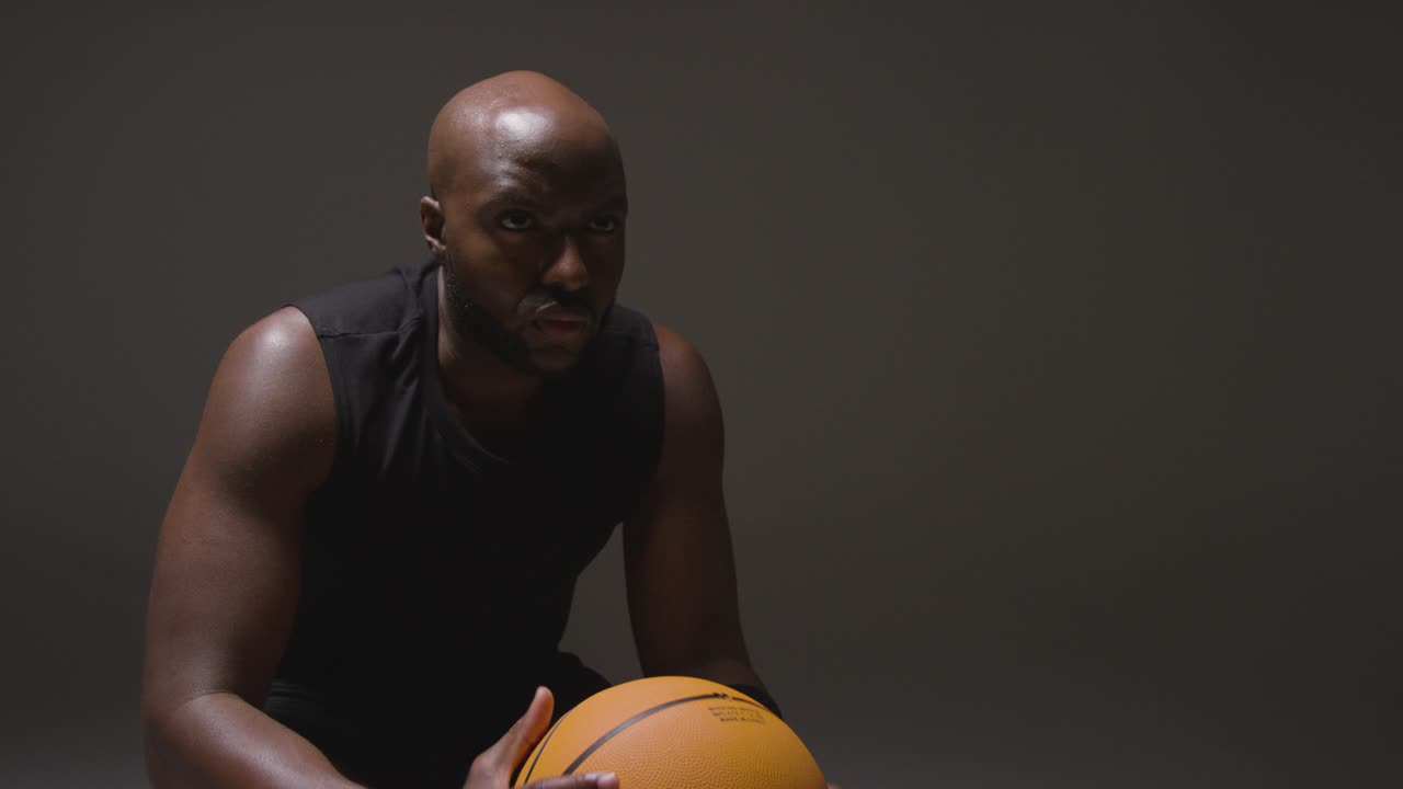 Free stock video - Studio shot of seated male basketball player with ...