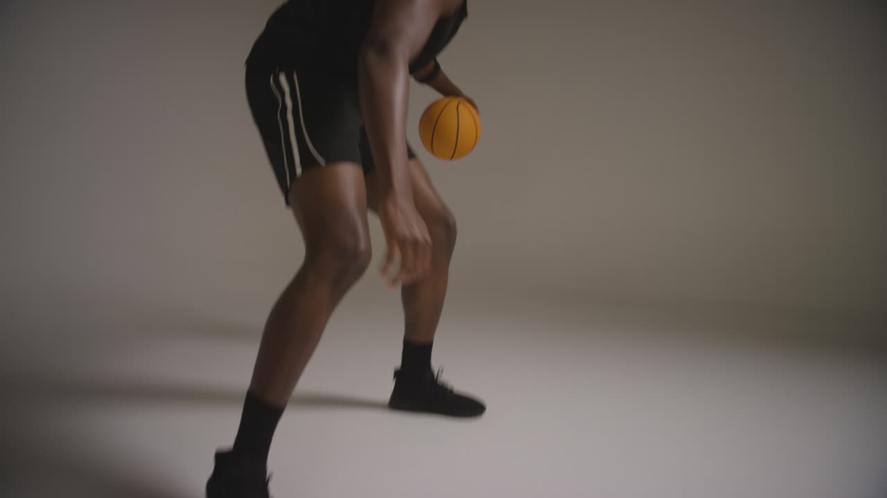 Free stock video - Studio shot of male basketball player dribbling and ...