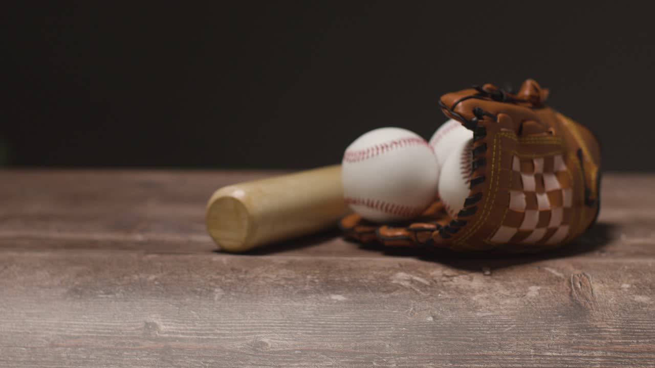 Free stock video - Close up studio baseball still life with wooden bat ...