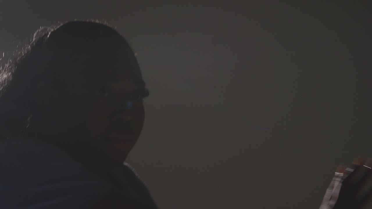 Free stock video - Backlit head and shoulders studio portrait shot of ...