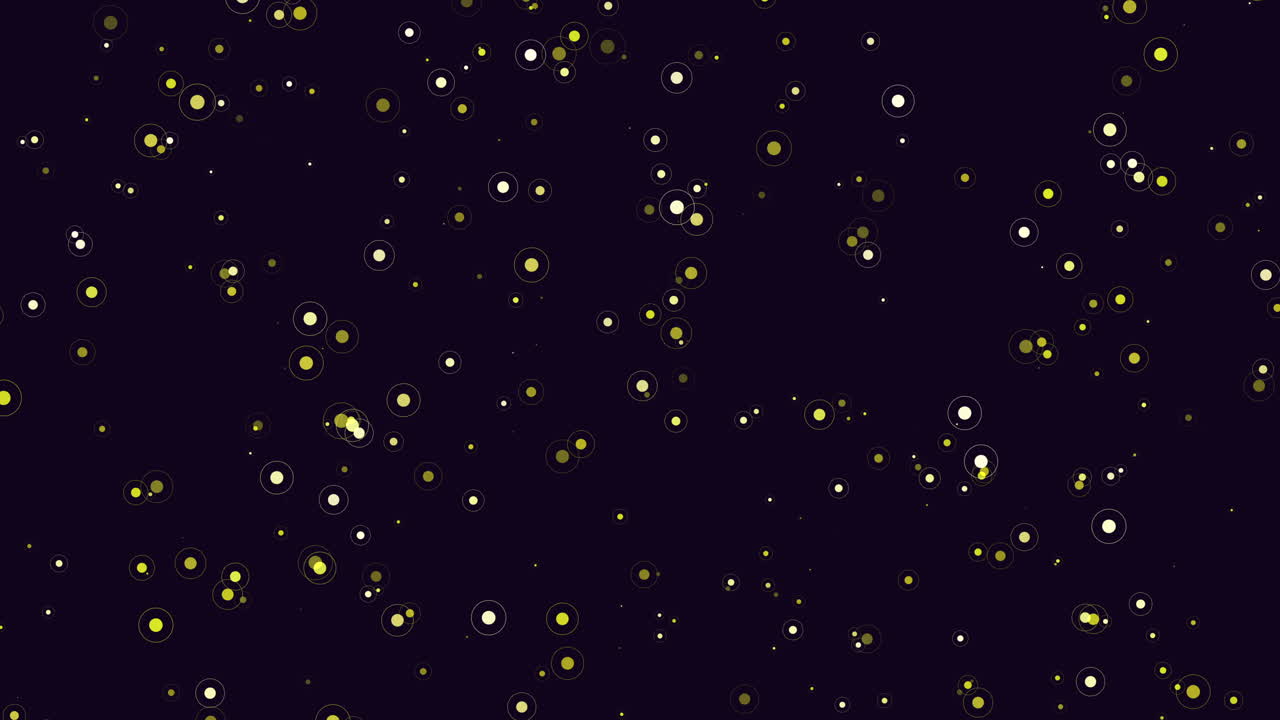 Premium stock video - Vibrant yellow dots scattered on black background