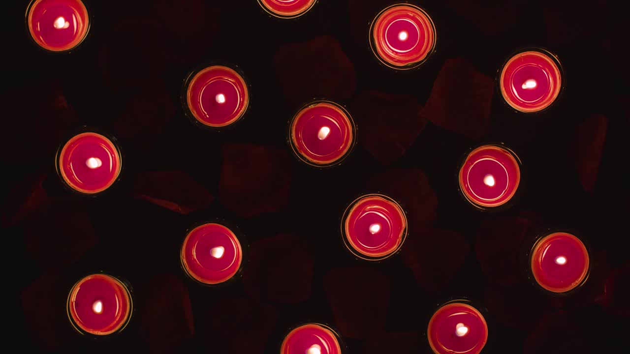 Free stock video - Overhead shot of romantic lit red candles on ...
