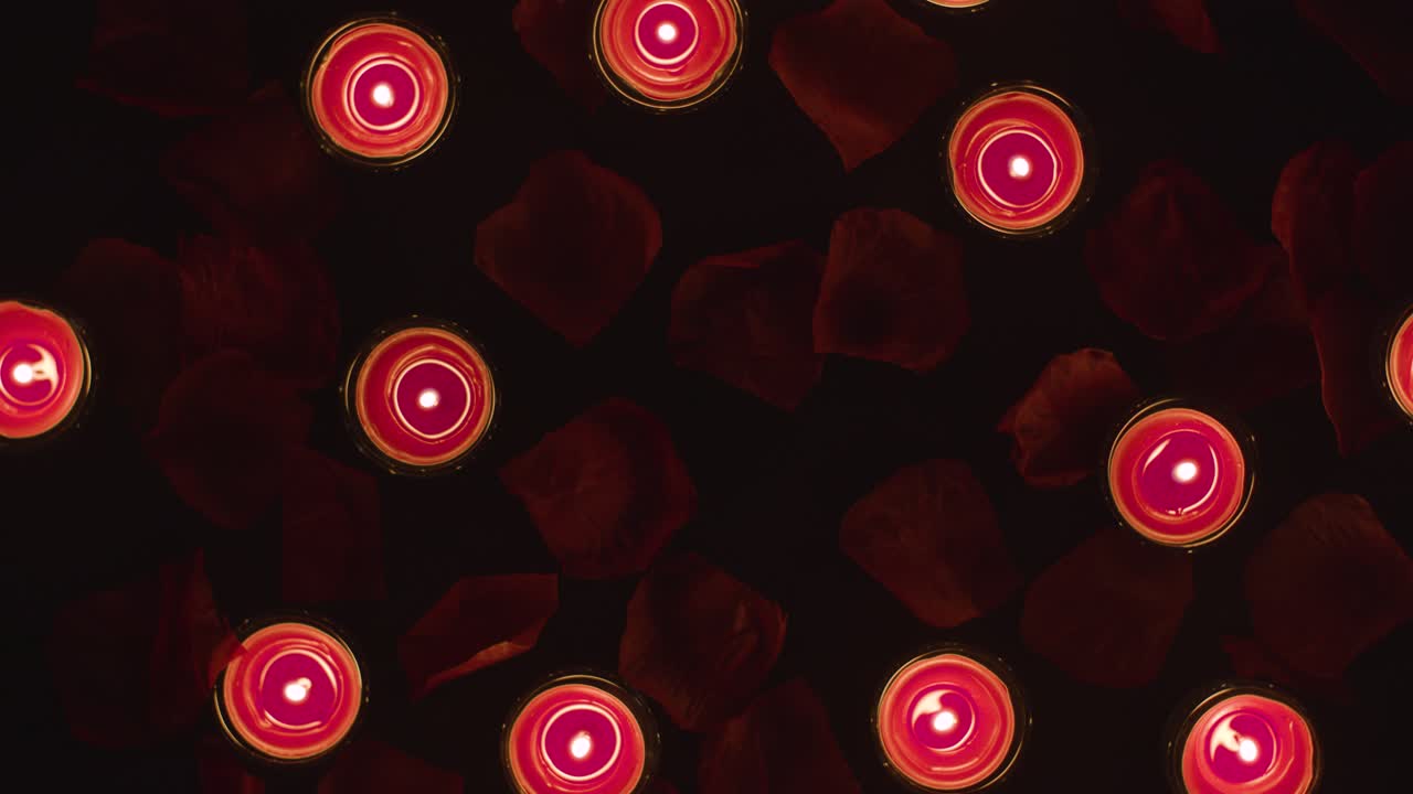Free stock video - Overhead shot of romantic lit red candles revolving ...
