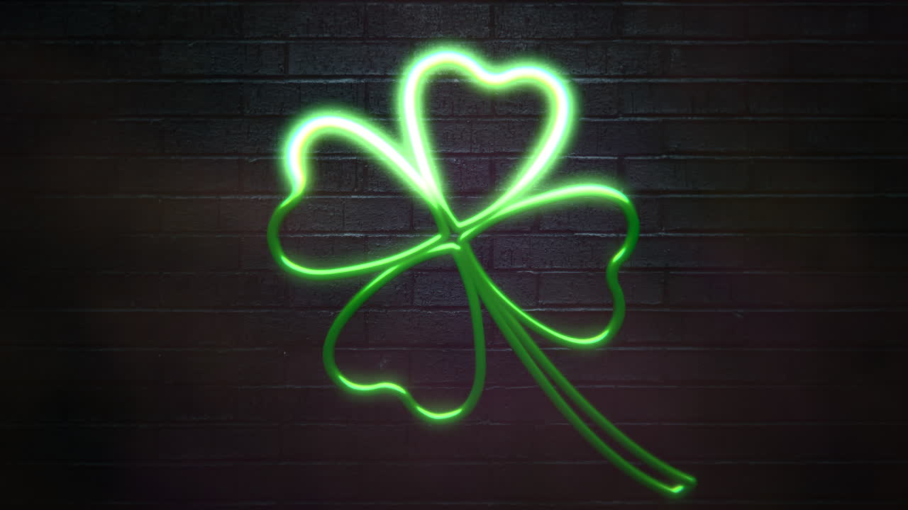 Premium stock video - Green neon shamrock on brick wall