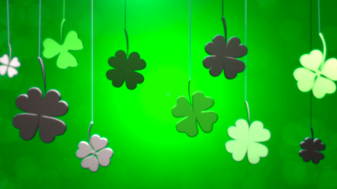 Premium stock video - Hanging irish shamrocks on green gradient