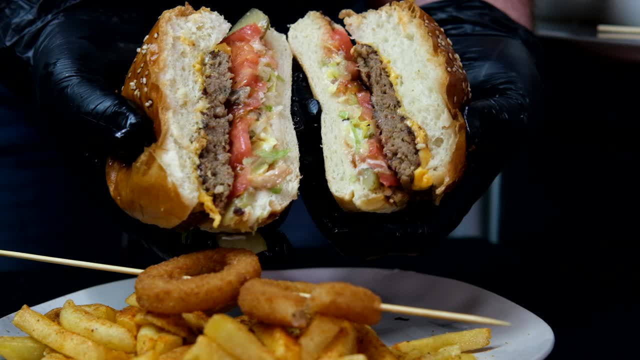 Premium stock video - Cut burger in half