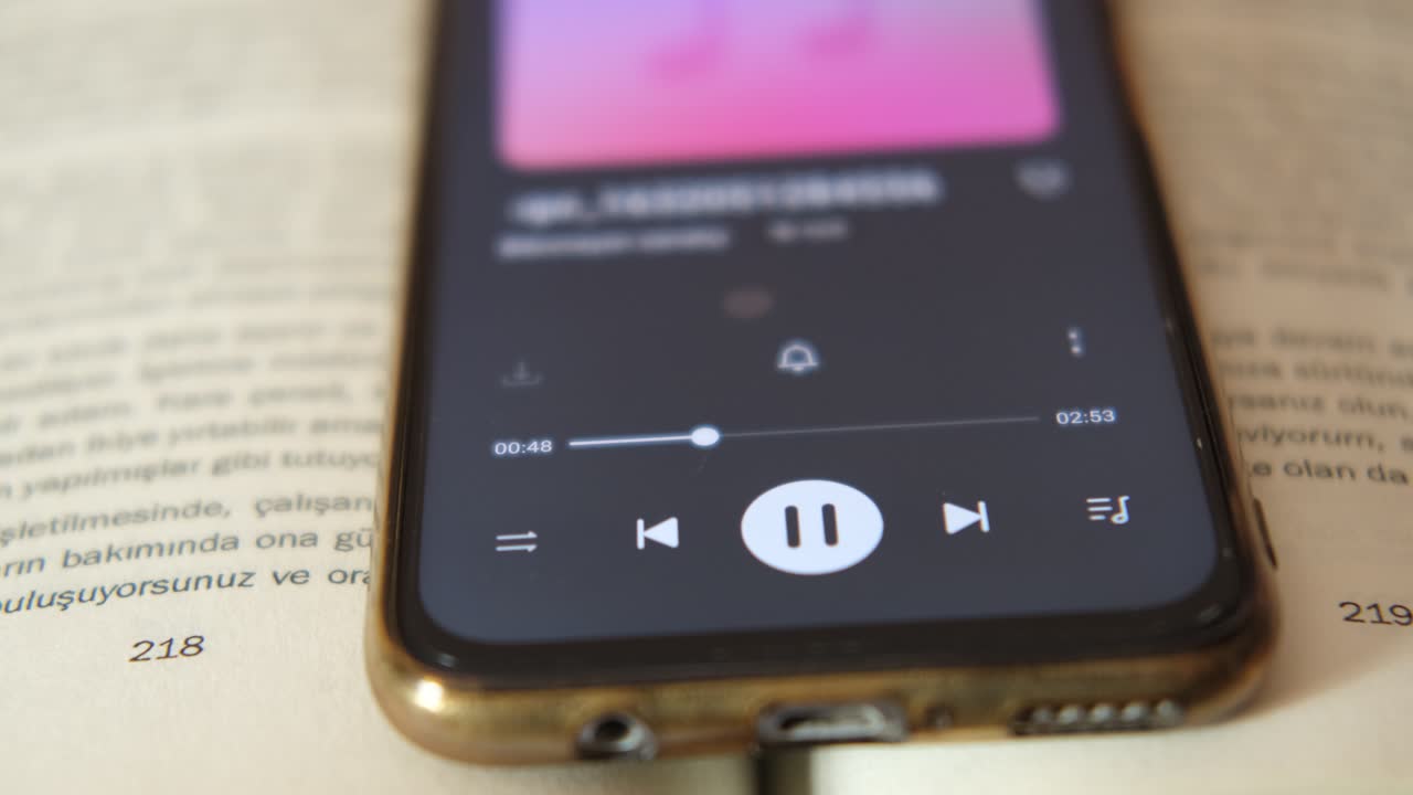 Premium stock video - Pause song while reading