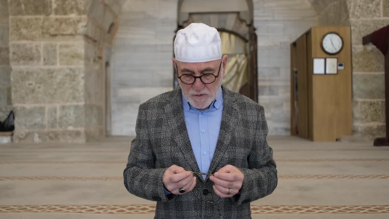 Premium stock video - Man count rosary