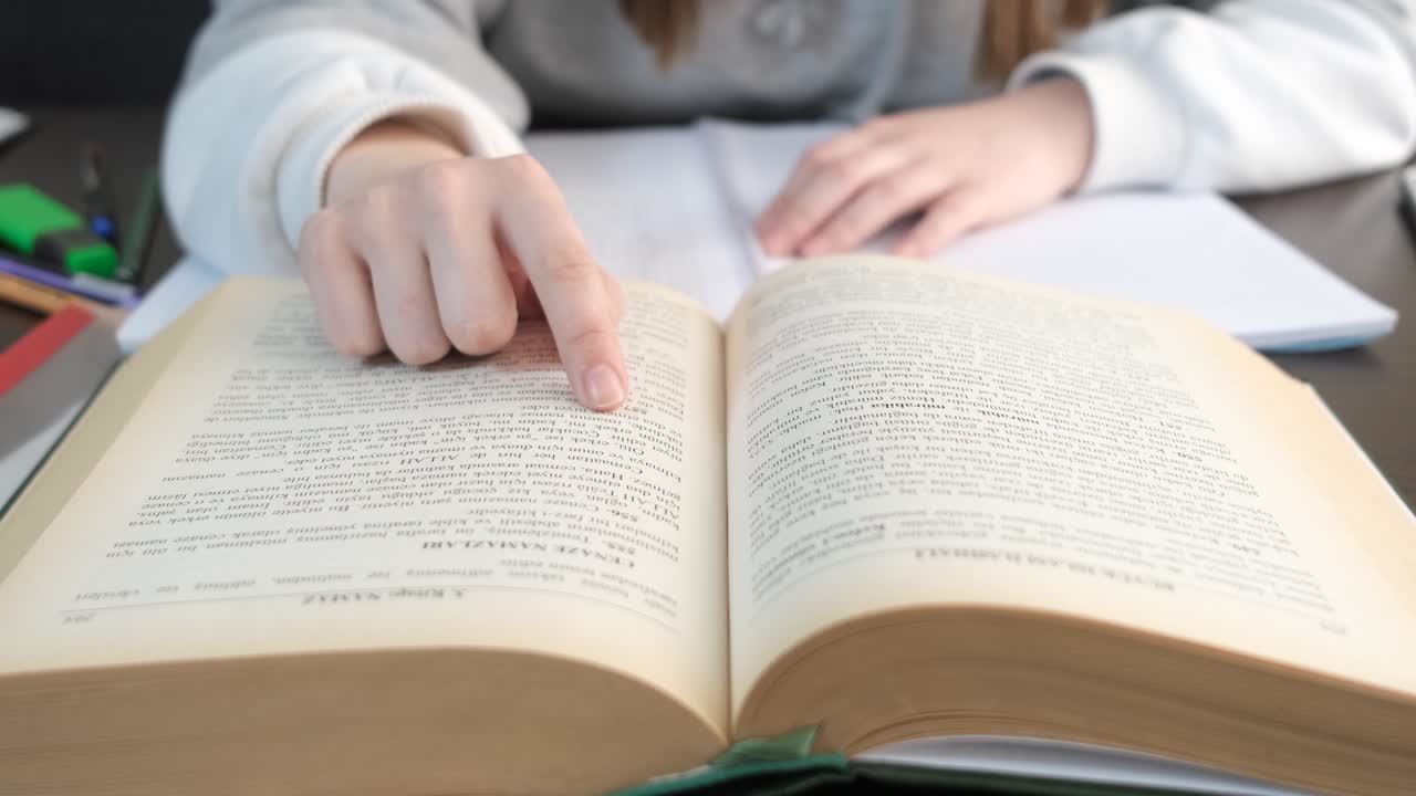 Premium stock video - Taking note from book