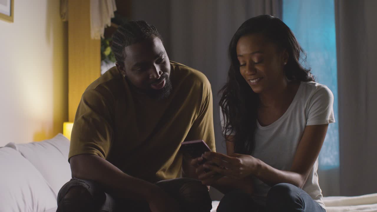 Free stock video - Young couple relaxing at home at night in bedroom ...