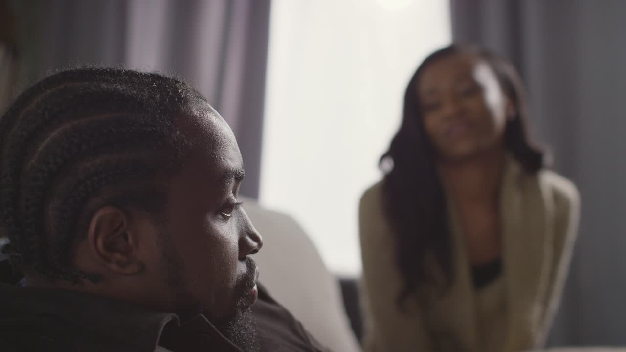 Free stock video - Close up of couple at home sitting on sofa in lounge ...