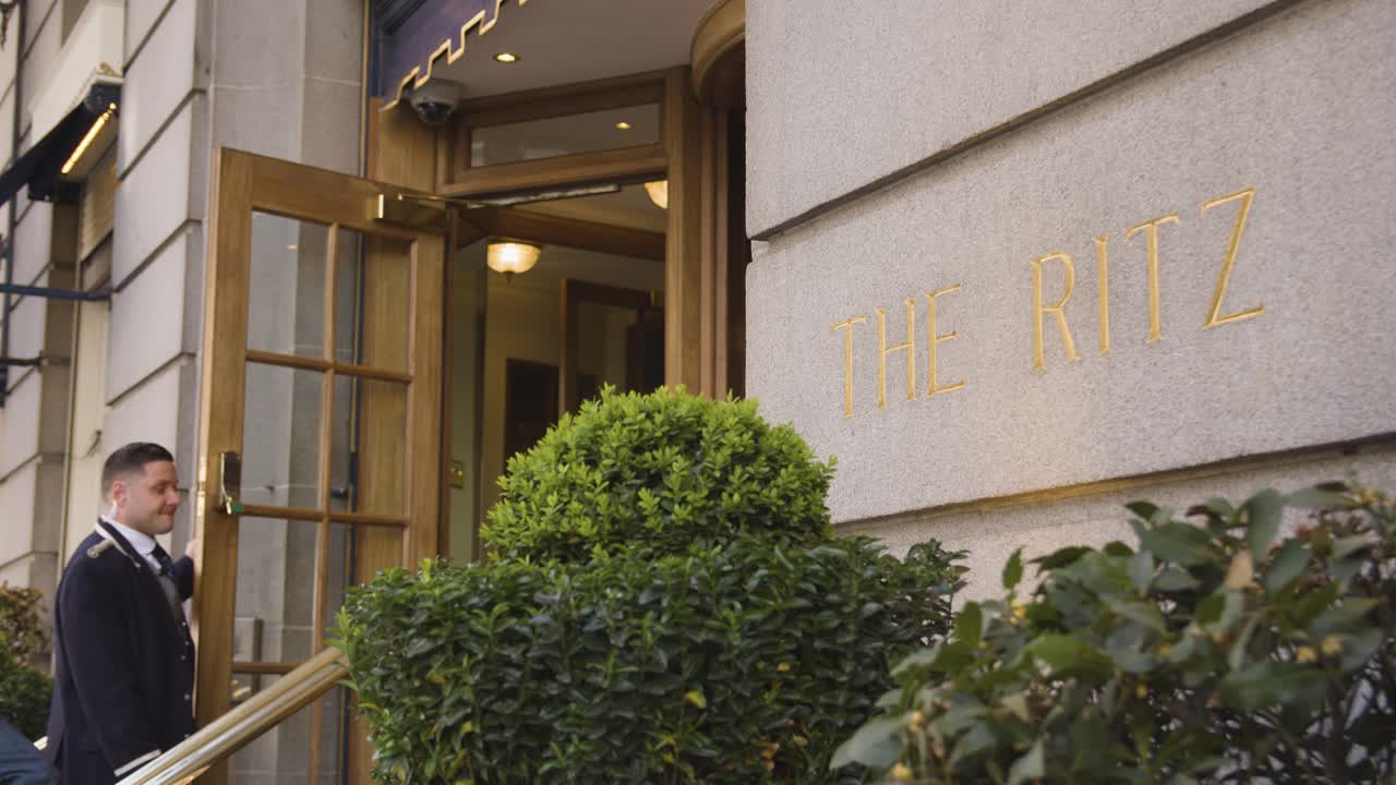 Free stock video - Close up of sign outside the ritz hotel and doorman ...