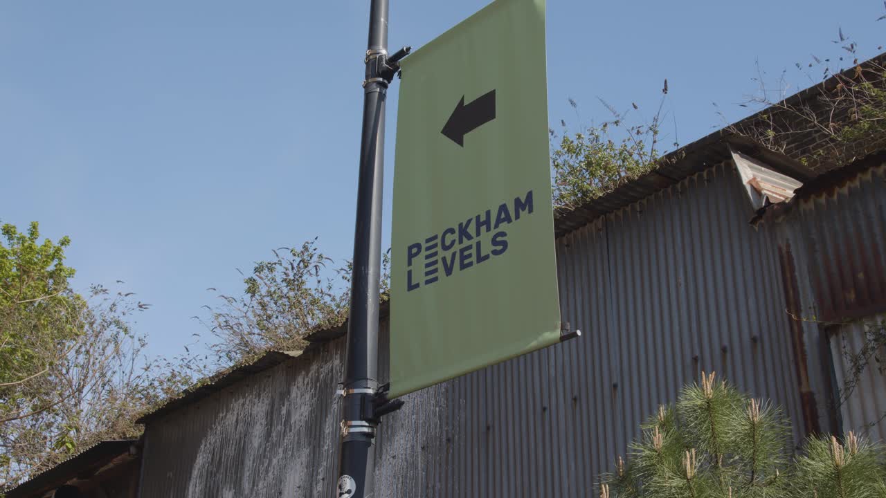 Free stock video - Close up of sign for peckham levels repurposed car ...