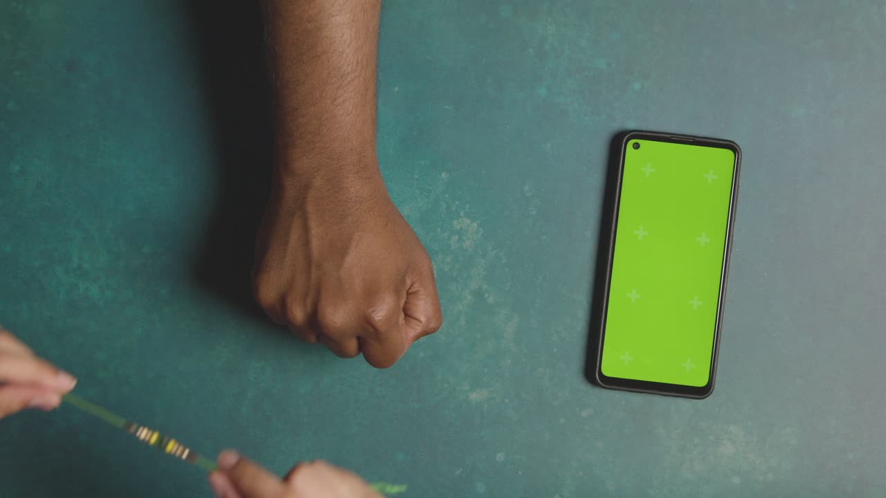 Free stock video - Sister ties rakhi on brother next to chroma key ...