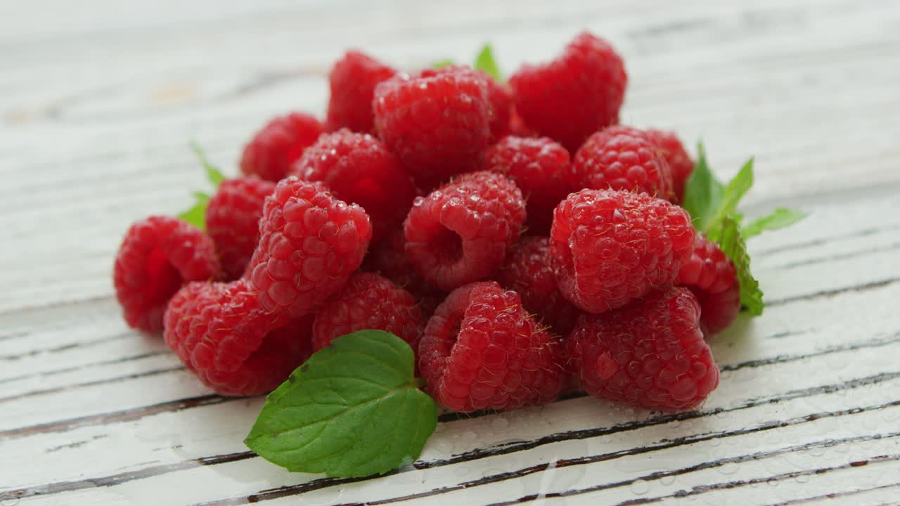 Premium stock video - Pile of fresh bright raspberries