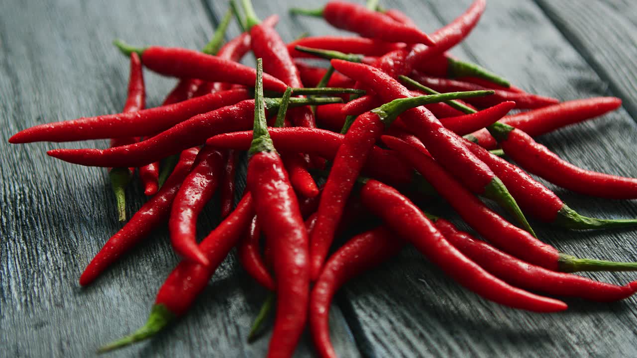 Premium stock video - Pile of bright red chili peppers