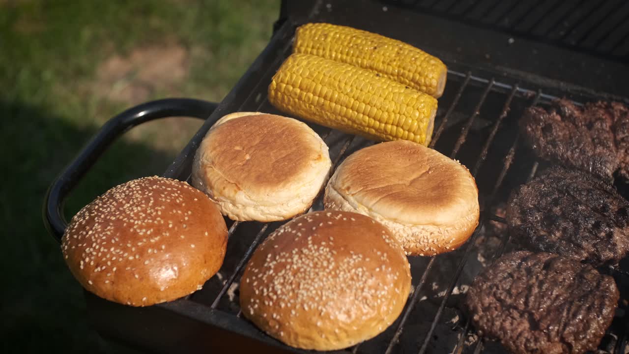 Premium stock video - Mixed american barbecue food on hot grill