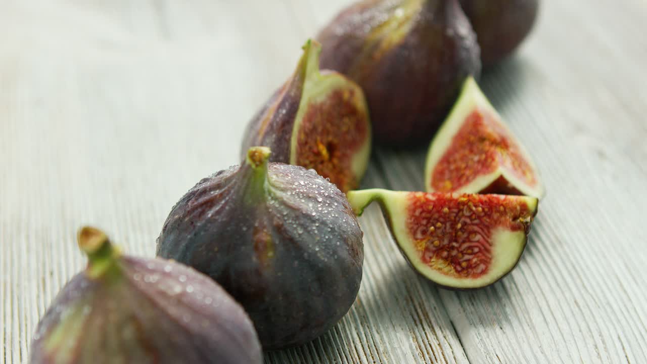 Premium stock video - Row of figs on table