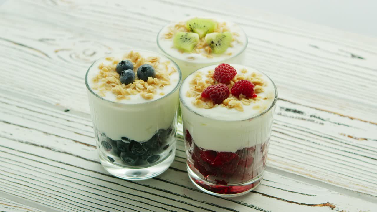 Premium stock video - Cups with berries and cream